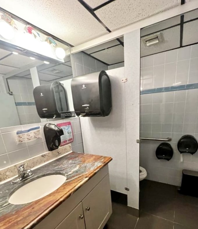 Even the bathroom keeps it real—no fancy marble countertops here, just honest Florida Keys charm right down to the plumbing.