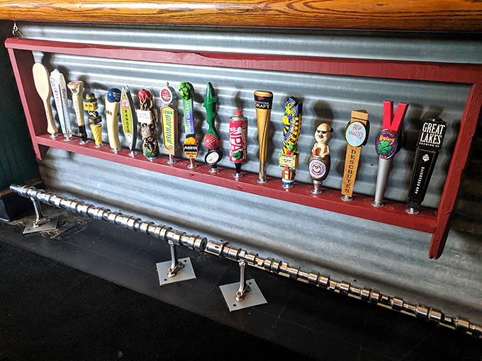 Beer taps lined up like soldiers ready for duty. Each handle tells a story of craft and tradition—liquid art waiting to be poured.