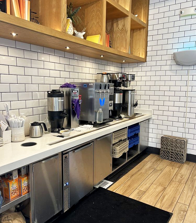 The beverage station's clean lines and subway tiles say "we take our drinks seriously"—even the non-alcoholic ones deserve this level of respect.