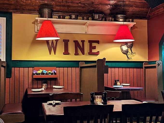 The "WINE" sign isn't just decor—it's a mission statement. Those red lampshades cast a glow that makes everyone look like they've made excellent life choices.