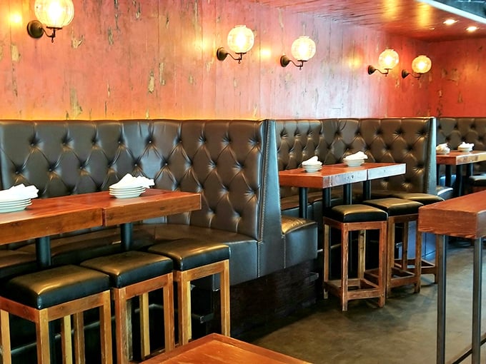 Leather booths and warm lighting create intimate dining nooks where you can focus on what matters: that mac and cheese you're about to devour.