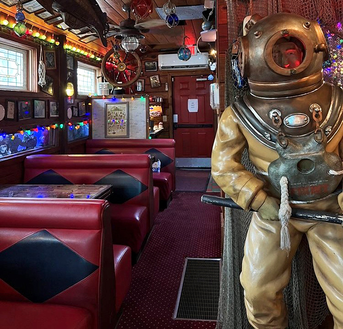 These red vinyl booths have witnessed countless celebrations while a vintage diver keeps eternal watch over the festivities.