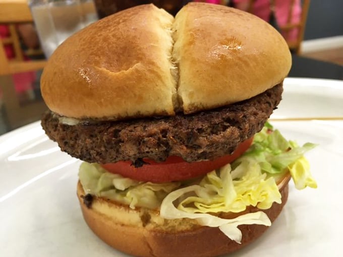 This burger isn't trying to reinvent the wheel – it's just perfecting it. A hand-formed patty on a split-top bun with fresh veggies that says, "Sometimes classics become classics for a reason."