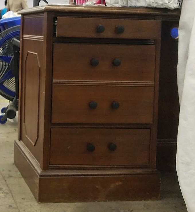 This vintage wooden dresser whispers tales of previous homes while awaiting its next chapter. Solid craftsmanship never goes out of style.