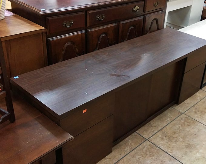 Solid wood furniture with good bones and better stories. That desk probably helped someone finish their novel or balance their checkbook for decades.