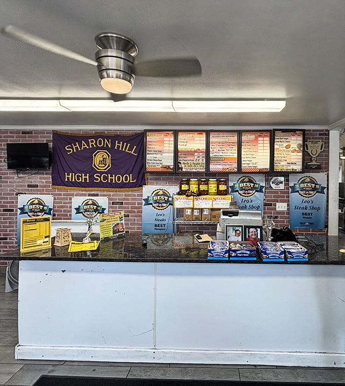 Where the magic happens—dedicated sandwich crafters working their culinary choreography behind the counter, turning orders into edible art.