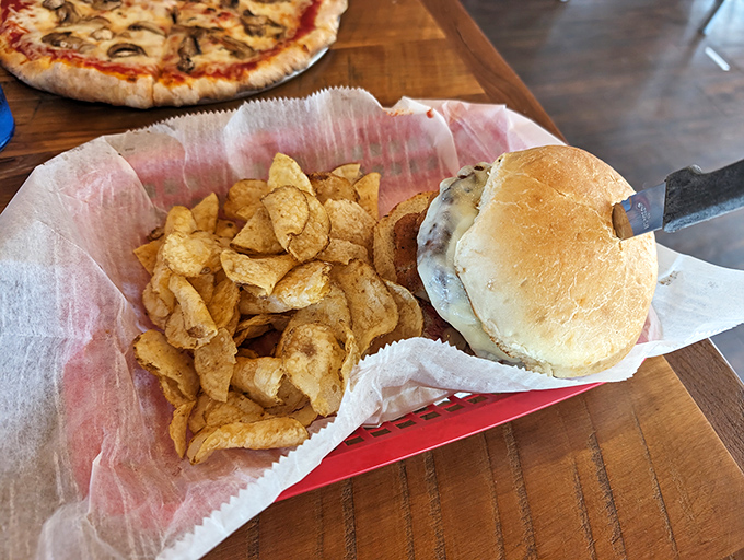 The humble cheeseburger—civilization's greatest achievement next to indoor plumbing. This one, with its perfectly toasted bun and house-made chips, is simplicity elevated.