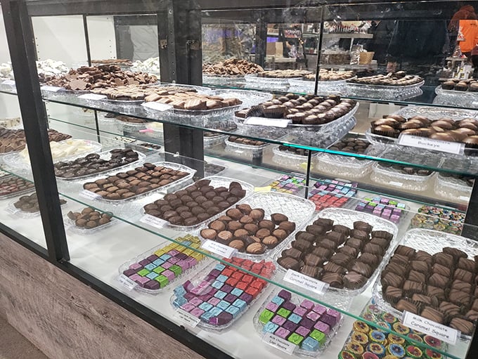 The chocolate counter—where diets go to die gloriously. These handcrafted confections make grocery store candy bars seem like a personal failure.