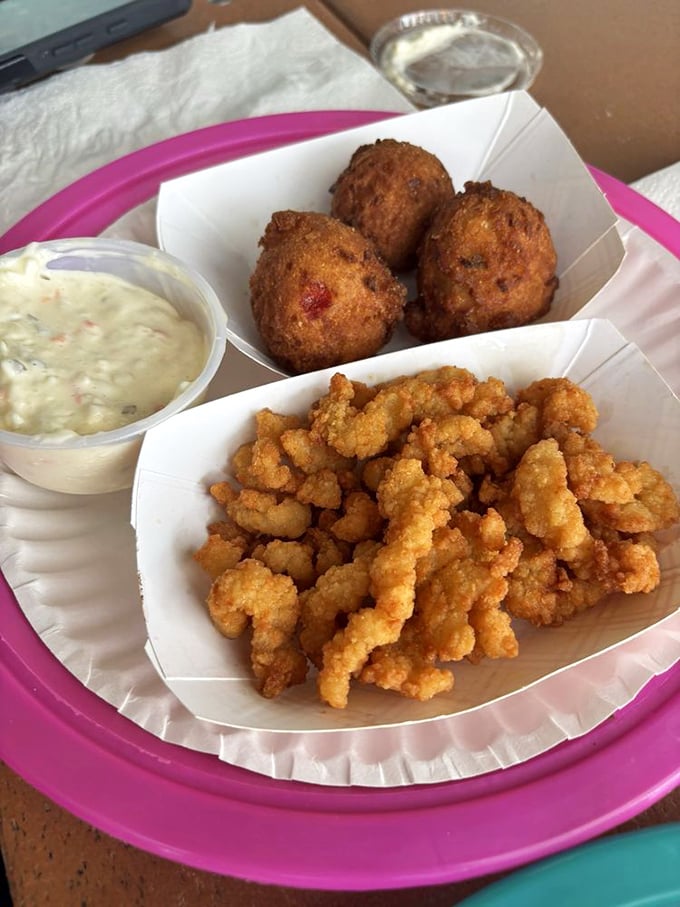 Clam strips and hush puppies – the dynamic duo of seafood shack appetizers that have launched a thousand food comas and zero regrets.