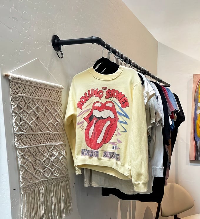 Rock 'n' roll never dies—it just gets better with age, like this vintage Rolling Stones tour shirt hanging among everyday treasures.