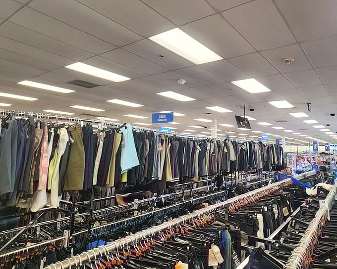 Clothing racks that stretch to the horizon—a denim sea where the perfect pair of pants hides like buried treasure.