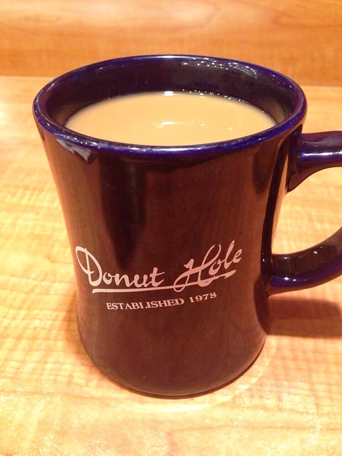 The navy blue mug says it all—this isn't just coffee, it's liquid tradition. The kind of brew that makes morning people out of night owls.