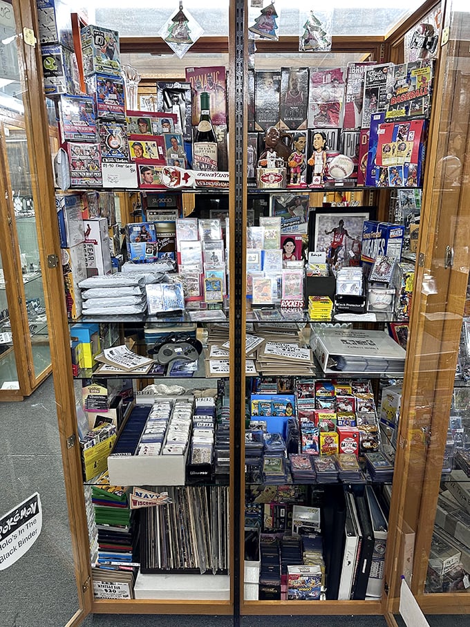 Sports memorabilia heaven behind glass—where childhood heroes and forgotten seasons remain forever in their prime.