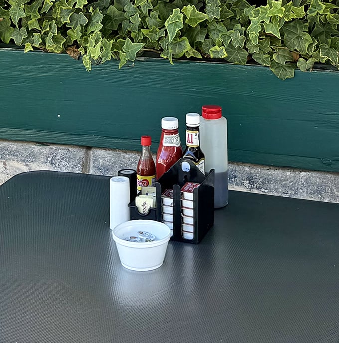 The condiment station – that sacred altar where hot sauce devotees and ketchup enthusiasts alike can customize their breakfast masterpieces.