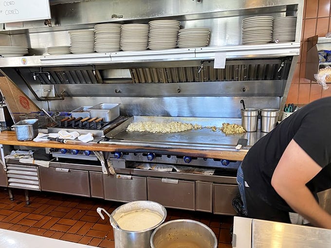The flat-top grill – hallowed ground where potato mountains transform into home fry masterpieces before your very eyes.