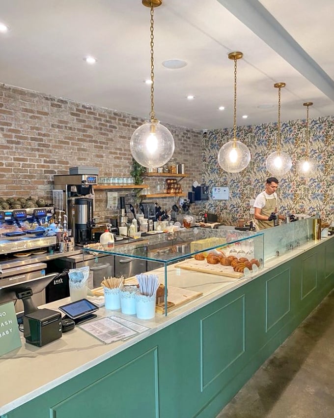 The counter showcases pastries with the pride of a parent displaying their child's art—except these creations are definitely fridge-worthy.