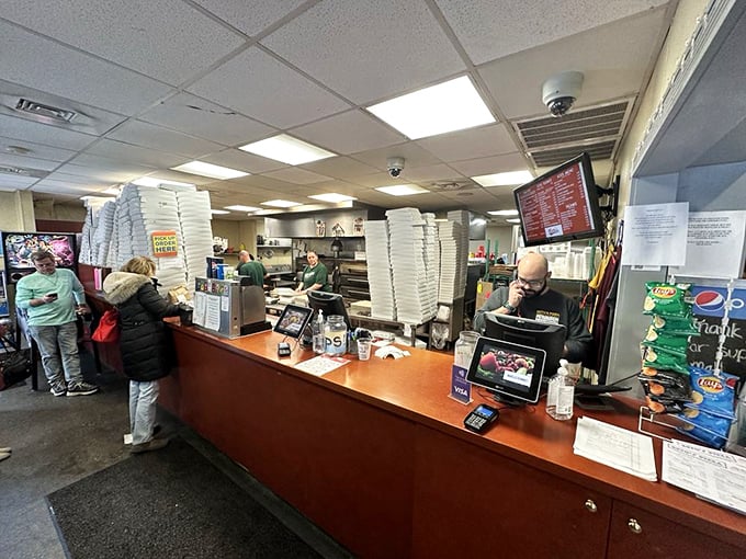 Where pizza orders happen – stacks of boxes standing at attention, ready for their mission to deliver cold-cheese revelations across Pittsburgh.