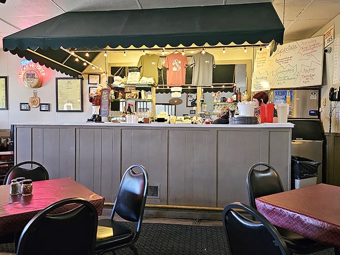 Behind this counter, culinary magic happens without fanfare or pretension—just the quiet confidence of people who know what they're doing.