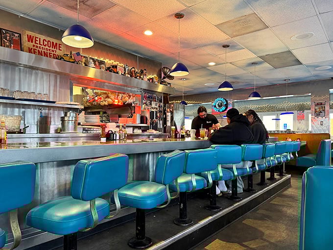 The counter seats offer front-row tickets to the short-order ballet, where coffee flows as freely as the conversation.