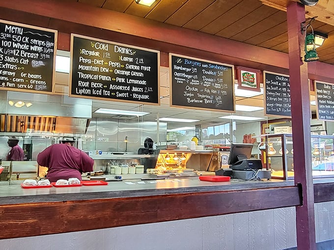 Behind the counter is where the magic happens—handwritten menu boards and bustling staff orchestrating a symphony of comfort food classics.