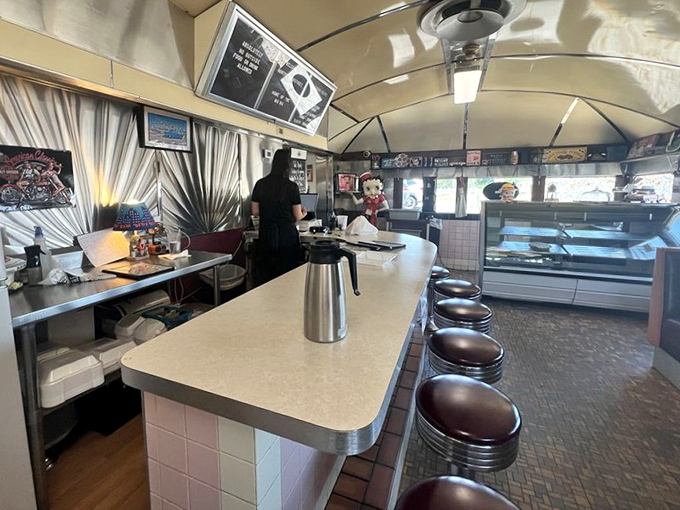 The counter seating offers front-row tickets to the best show in town—skilled short-order cooks turning ordinary ingredients into extraordinary comfort.