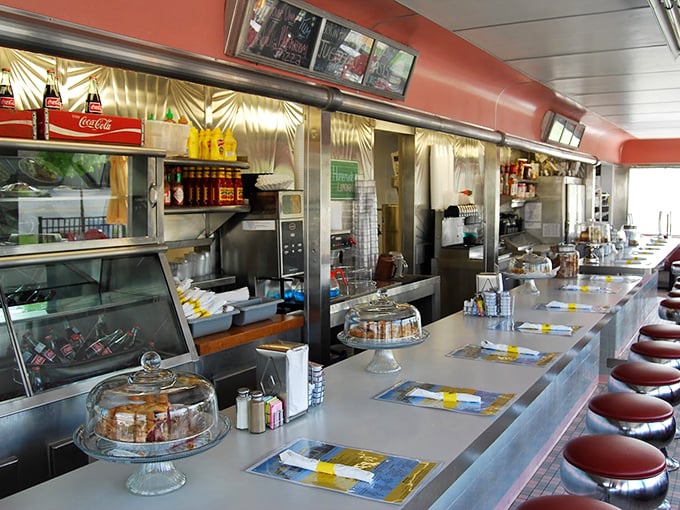 The counter where magic happens—where solo diners find community and where every order is a performance worth watching.