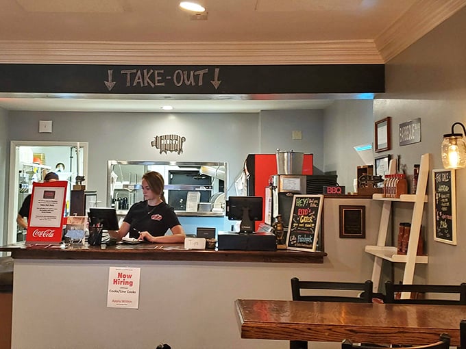 The take-out counter—where BBQ dreams begin their journey to your home. A portal to smoky happiness that starts with a simple order. 