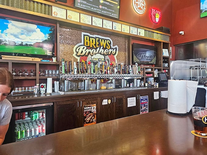 The bar – where dozens of tap handles stand like soldiers ready to serve, backed by that magnificent mosaic logo that hypnotizes you into ordering "just one more."