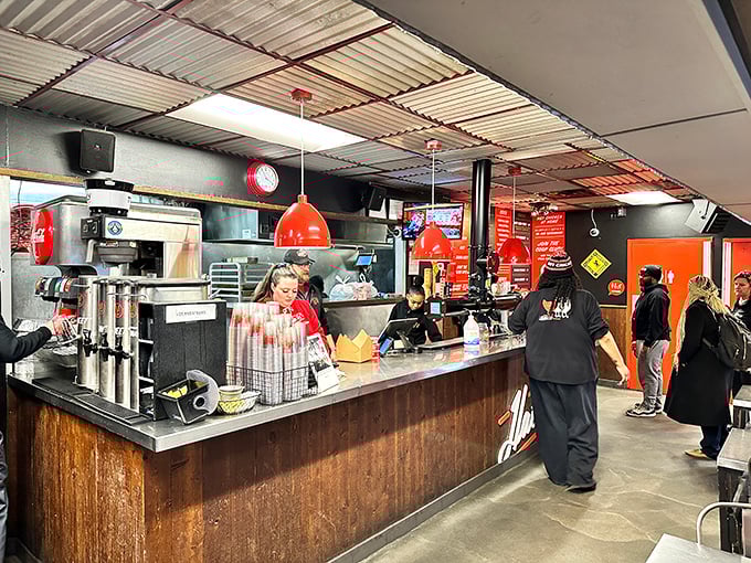 Behind that counter, they're not just taking orders—they're dispensing controlled culinary chaos that's transformed Nashville into a hot chicken pilgrimage site.