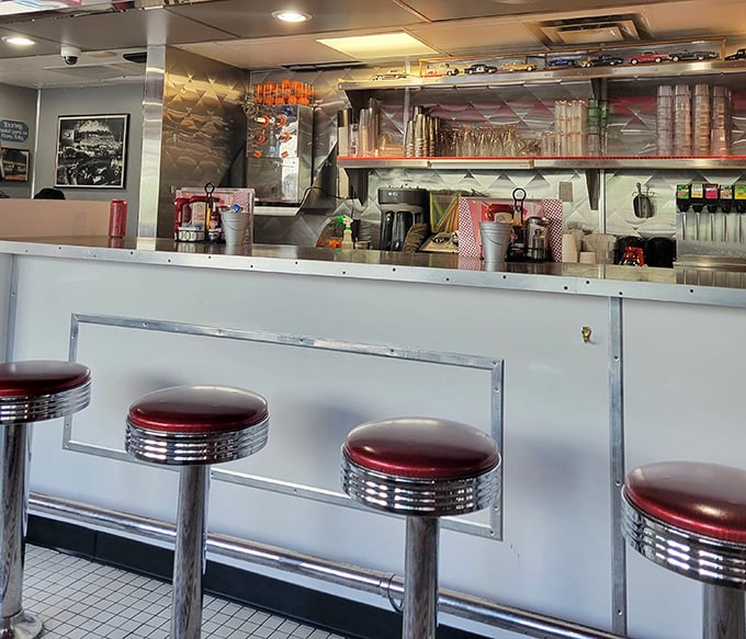 The counter seats – where solo diners become part of the diner family and the short-order symphony unfolds before your eyes in all its sizzling glory.