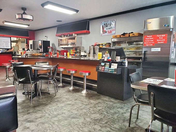 The counter at Nick's Kitchen—where regulars have their own unassigned-assigned seats and the coffee keeps flowing like conversation on a Sunday morning.