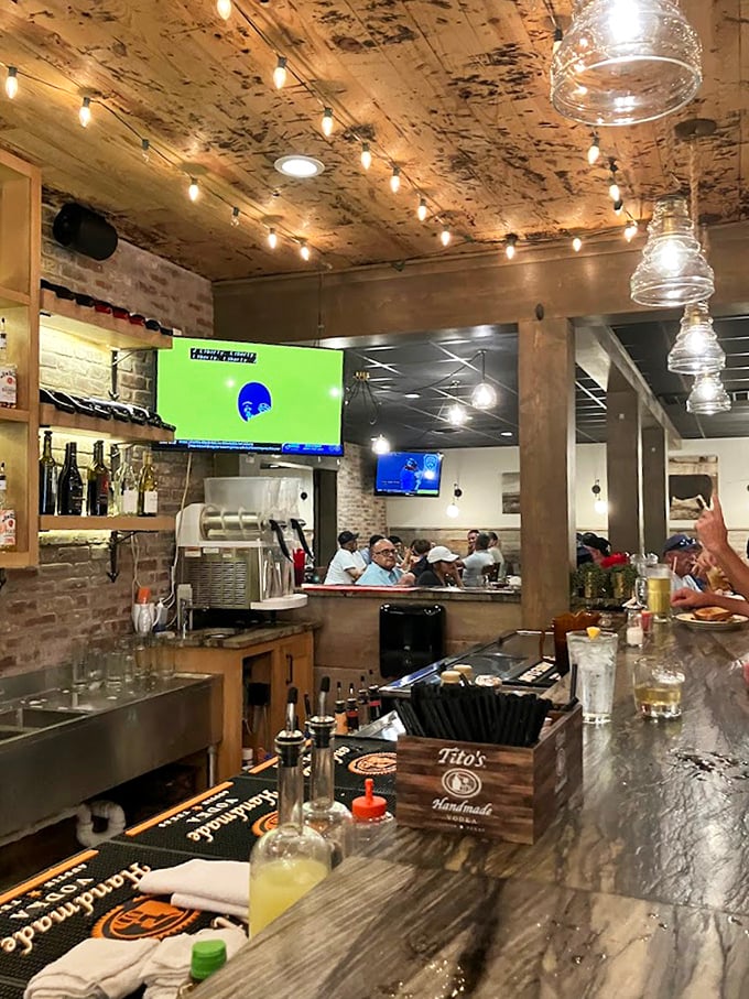 The bar gleams with promise, stocked with spirits that pair perfectly with perfectly grilled beef.