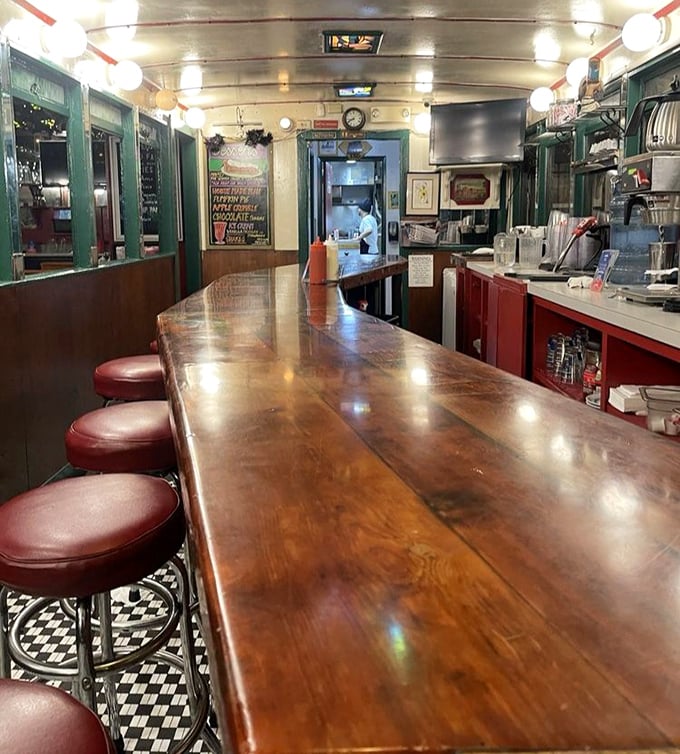 The counter—where solo diners find community, regulars hold court, and everyone has the best view of short-order magic.