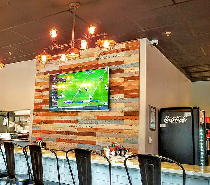 The rustic-meets-modern aesthetic isn't just Instagram bait—it's the perfect backdrop for the serious business of comfort food consumption.