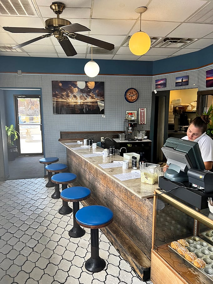 The counter view – where breakfast theater unfolds and regulars claim their spots like season ticket holders at a championship game.