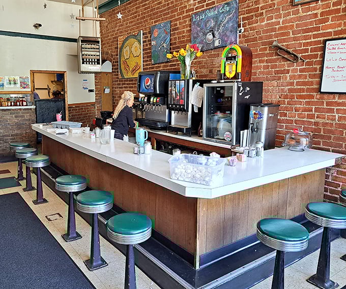 Classic diner counter seating—where solo diners become regulars and the coffee's always within arm's reach.