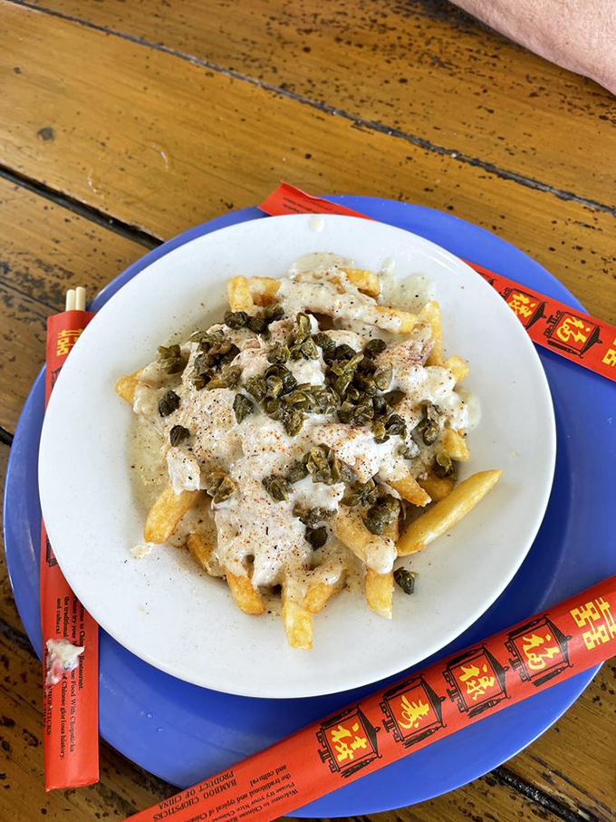Crabby fries – where French fries meet creamy crab sauce and capers in a combination that should be illegal but thankfully isn't.