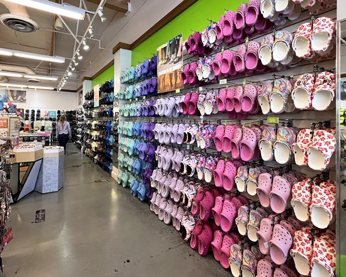 The Crocs store presents a wall of comfortable controversy—footwear that divides families but unites those who prioritize comfort over conventional beauty.