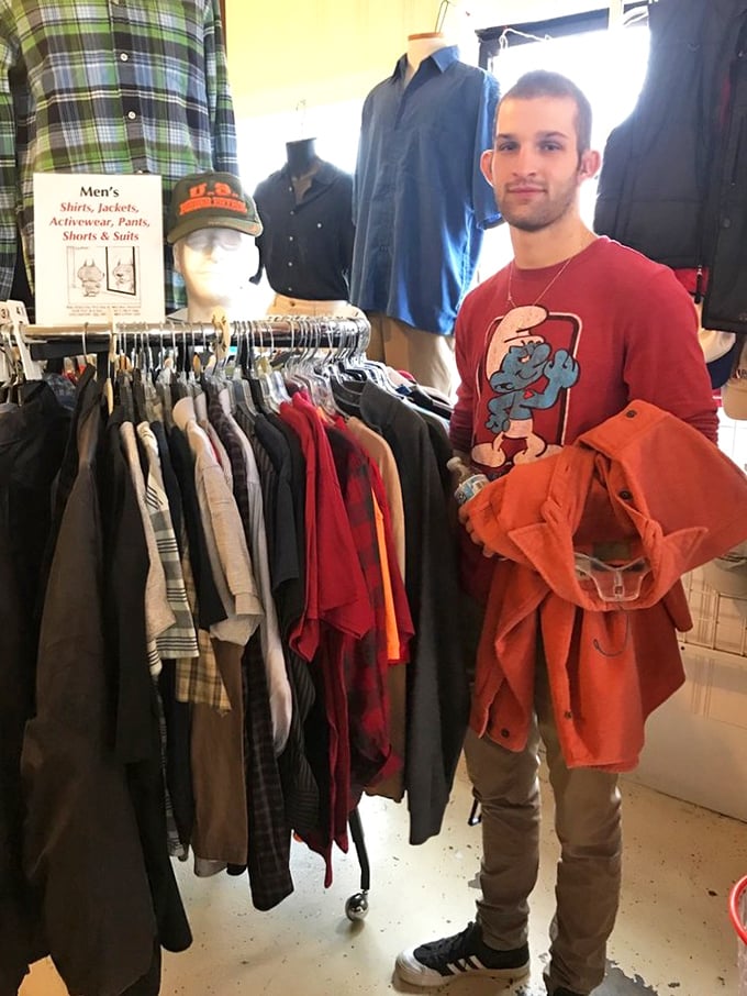 A happy customer scores his perfect find. That moment when you discover exactly what you didn't know you needed—pure thrift magic.