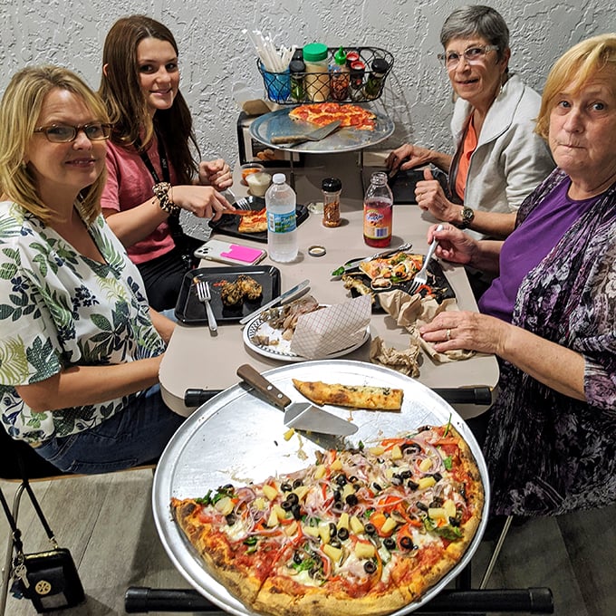 The true measure of a great pizza place? The smiles around the table as everyone digs in. Community happens one slice at a time.