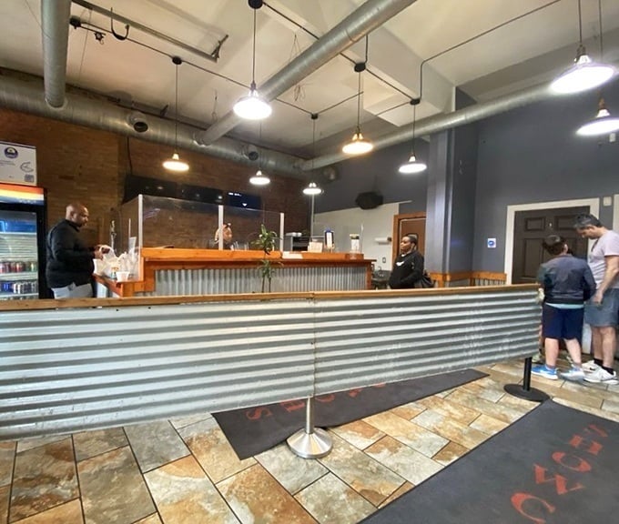 The ordering counter—where anticipation begins. That corrugated metal and wood combination is Pittsburgh industrial chic at its finest.