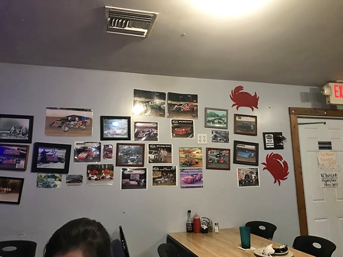 The wall gallery of racing photos and crab decorations tells you everything—this place values speed in cars but takes its sweet time with seafood.