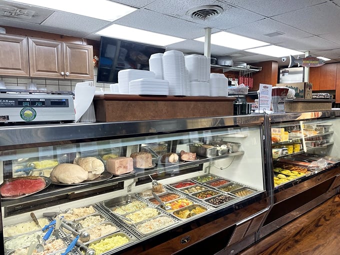 The deli counter – where magic happens daily as meats are sliced to order with the precision of a surgeon who's traded scalpels for deli knives.