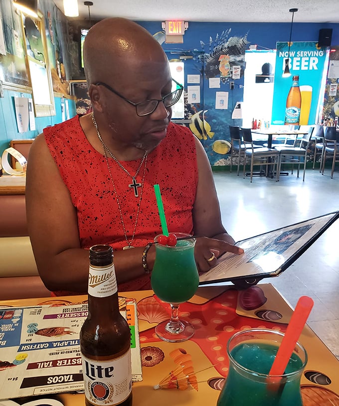 Colorful drinks and good company—the universal language of a great dining experience. That turquoise cocktail is practically begging to be Instagrammed.