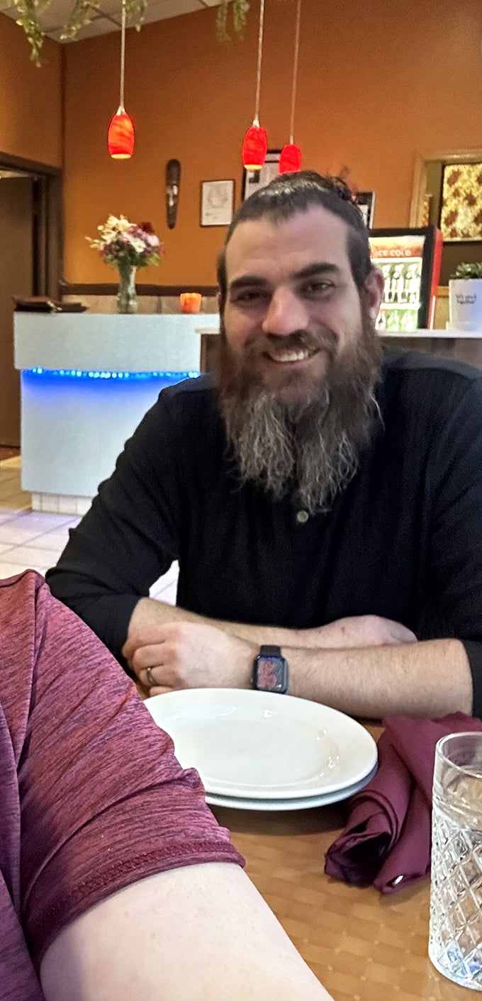 A happy diner enjoying the moment – the universal expression of someone who's just discovered their new favorite restaurant.