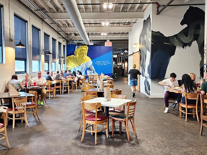 Art watches over diners like benevolent barbecue deities. The murals aren't just decoration – they're visual appetizers for the feast to come.