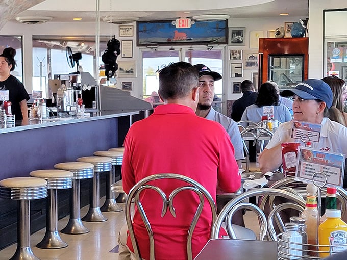 Where locals gather at the counter, trading stories over coffee while waitresses call everyone "hon" and mean it.