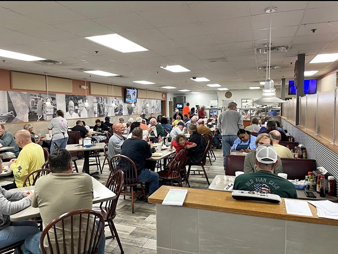 A room full of diners who understand that good conversation pairs perfectly with better food—the soundtrack of Southern dining at its finest.