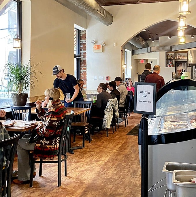 Where pizza dreams come true—diners enjoying the fruits of centuries-old Italian traditions in a cozy Pittsburgh corner.