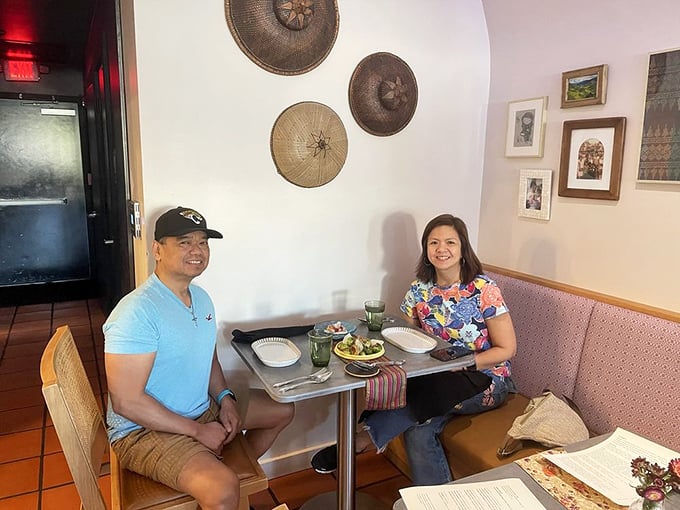 "Happy diners experiencing what might be the best meal of their Florida week. That smile says, 'I'm already planning my next visit.'"